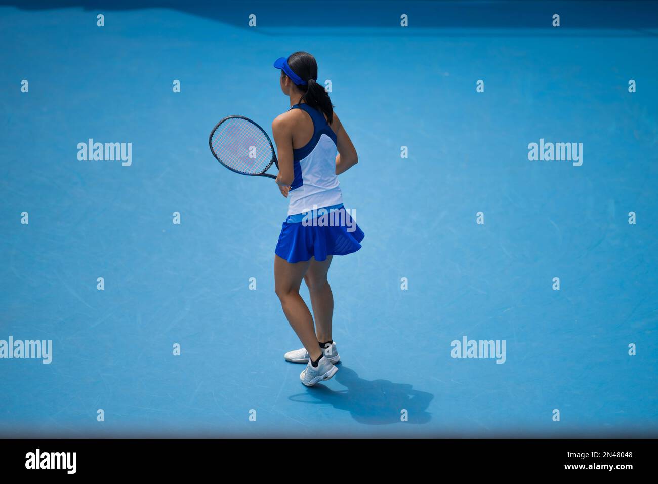 Beautiful female athlete playing tennis. Amateur female tennis player ...