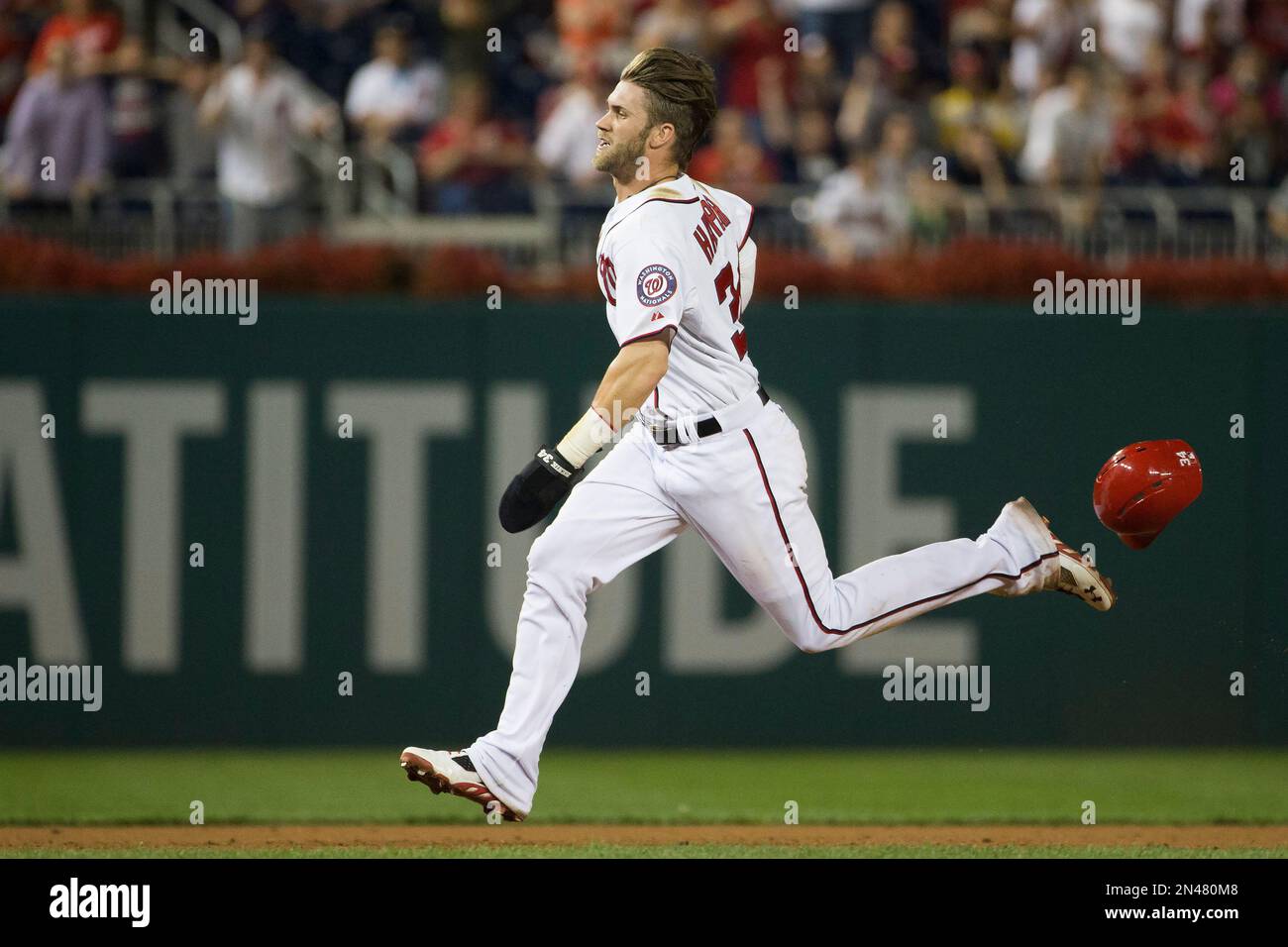 Washington Nationals' Bryce Harper runs to third base on a single by ...