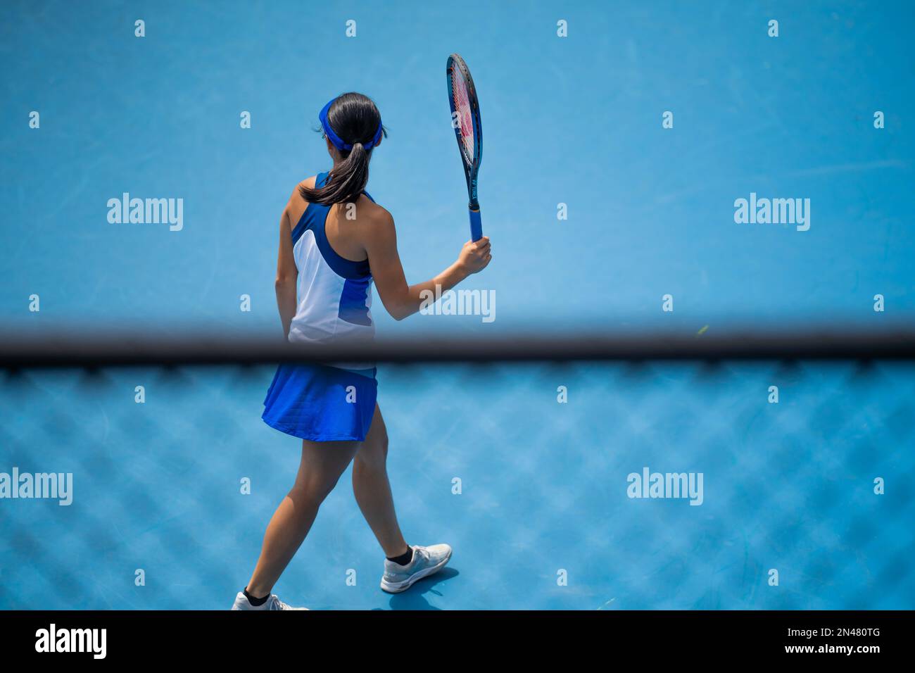 tennis fan watching a tennis match at the australian open eating food ...