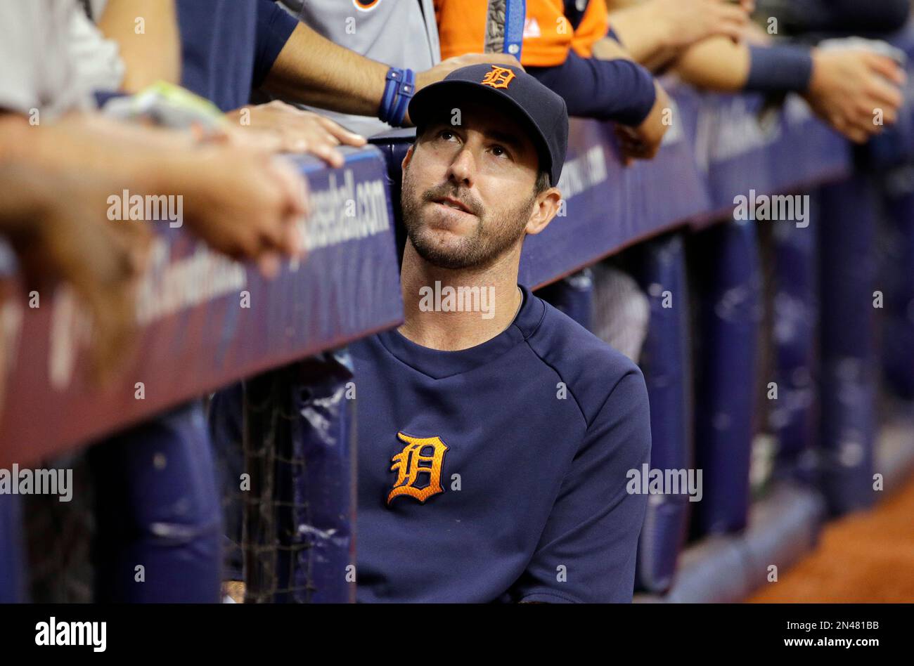 Detroit Tigers pitcher Justin Verlander sits on the turf during the ...