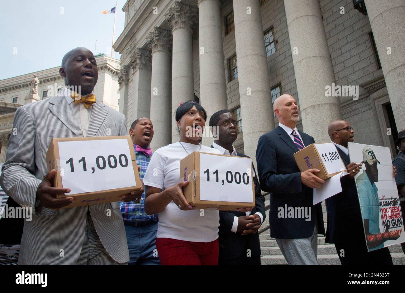 Flanked by their attorneys Royce Russell, far left, and Jeff Emdin ...
