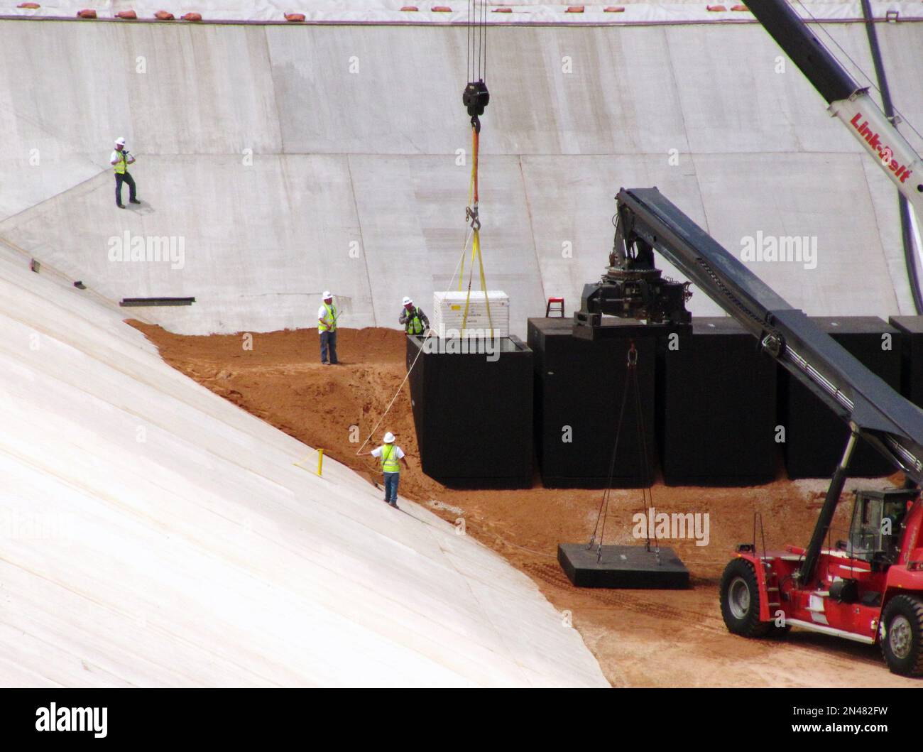 FILE - In this June 6, 2013 file photo, crews from Waste Control ...