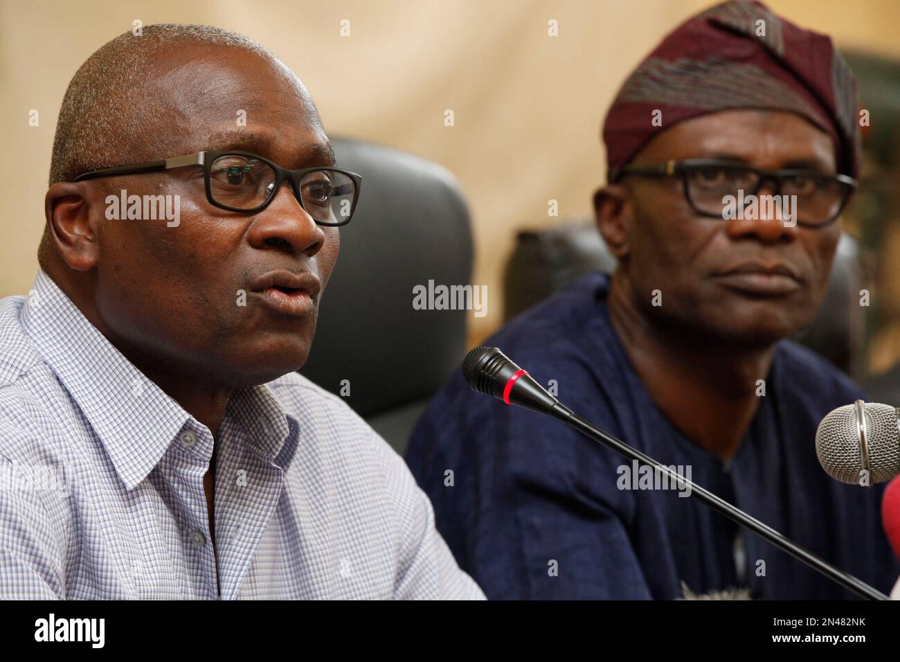Lagos State Health Commissioner Jide Idris, left, speaks during a news ...