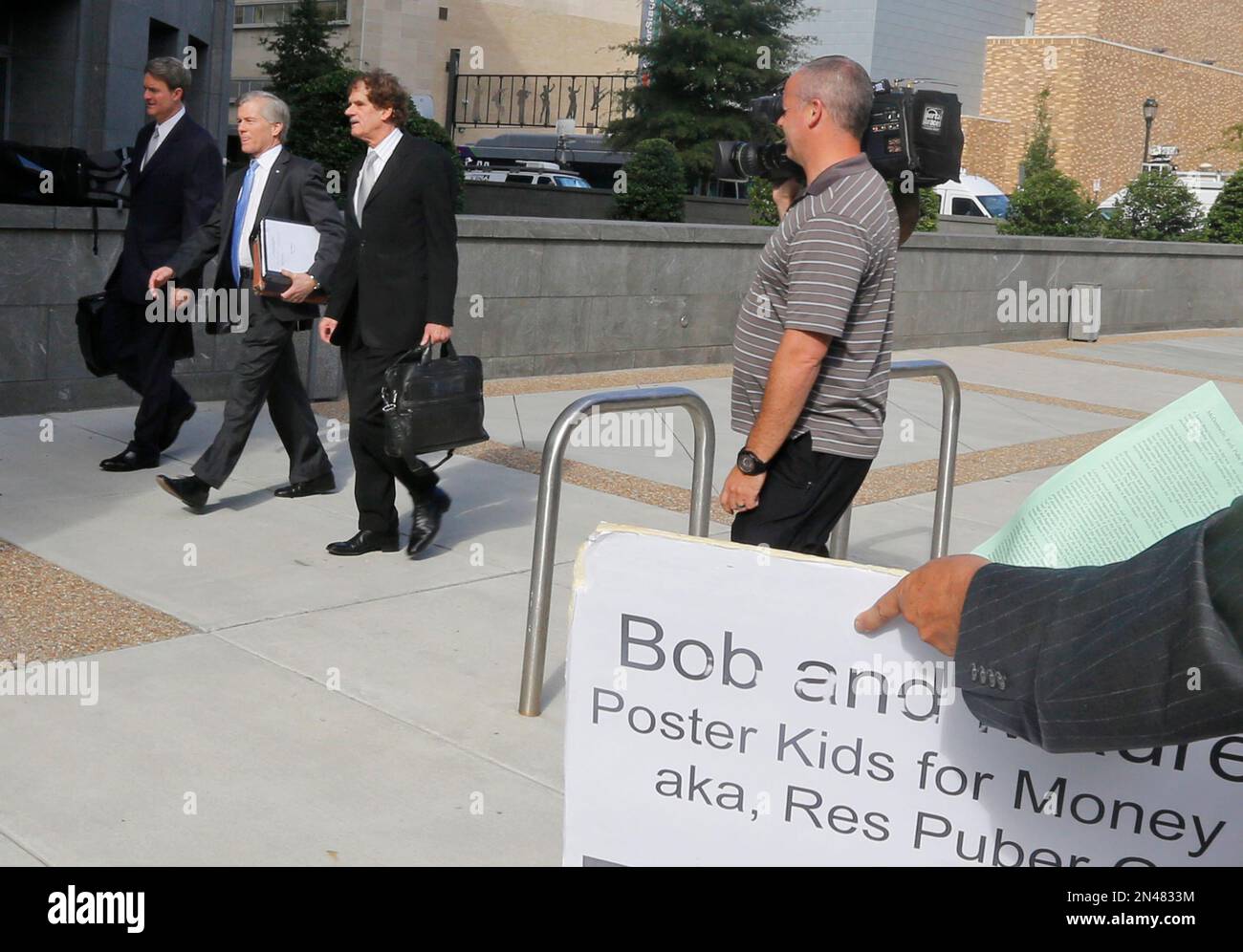 Former Virginia Gov. Bob McDonnell , second from left, arrives at ...