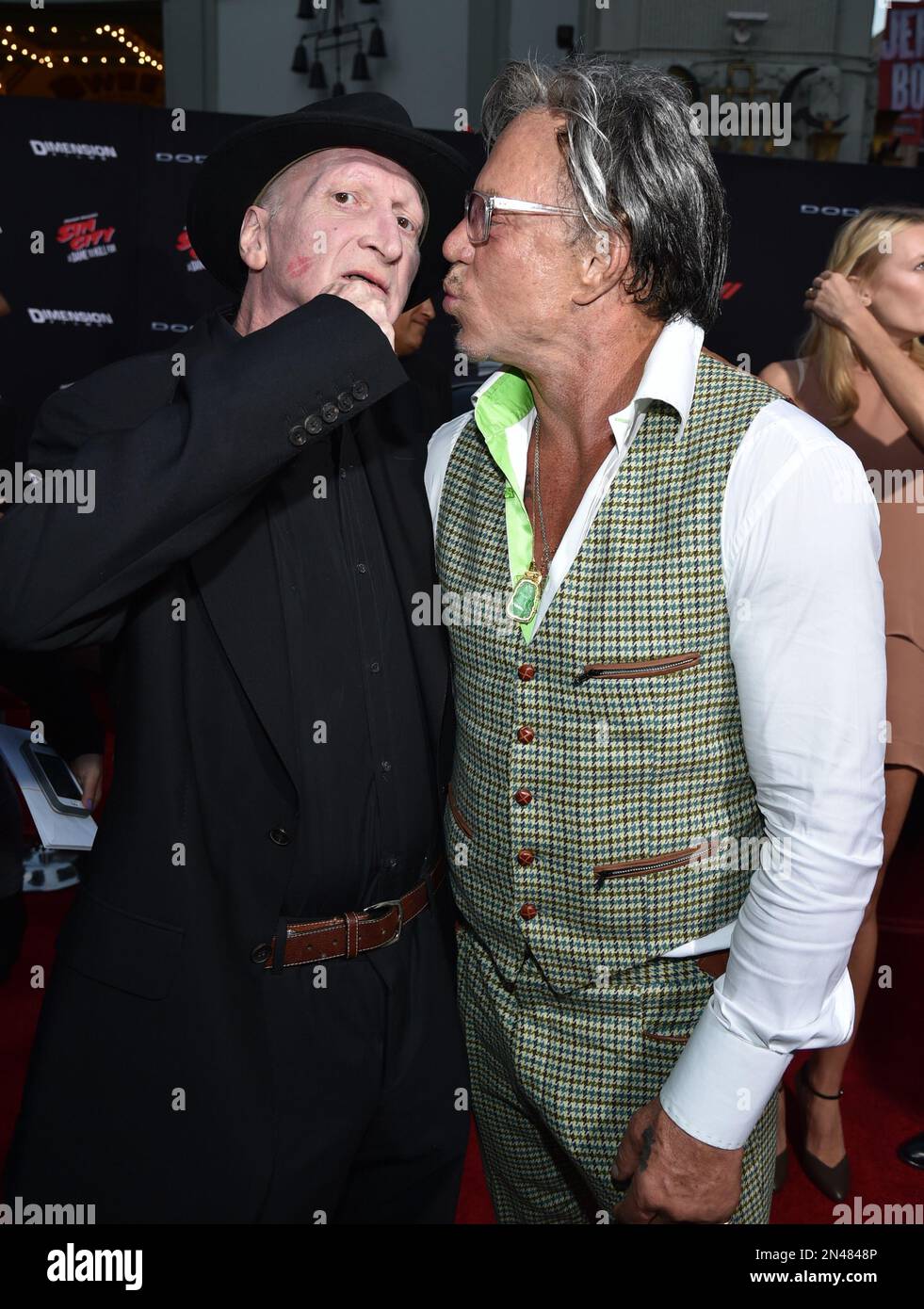 Writer/director Frank Miller, left, and Mickey Rourke arrive at the ...