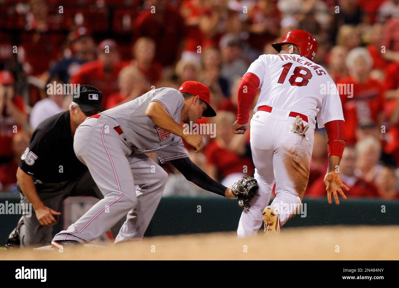 Cincinnati Reds third baseman Kris Negron tags out St. Louis Cardinals ...
