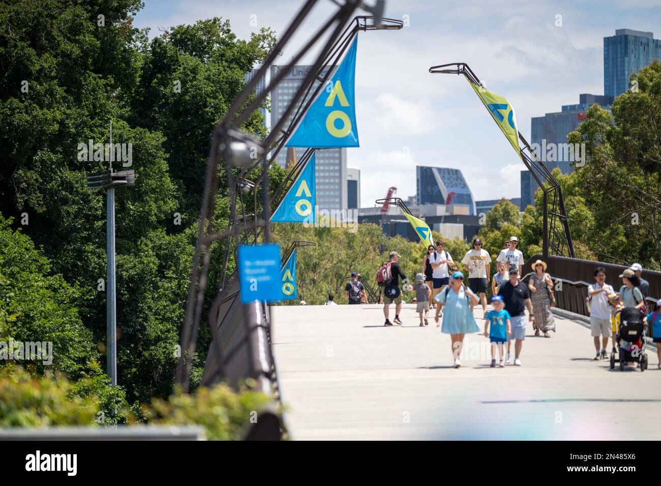 Tennis player serving in a tennis match, with leg drive in a game of ...