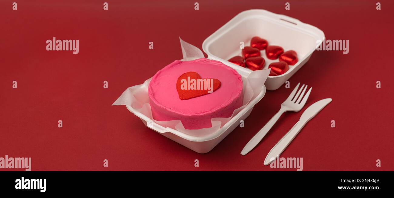Pink bento cake with heart In box on the red background Stock Photo - Alamy