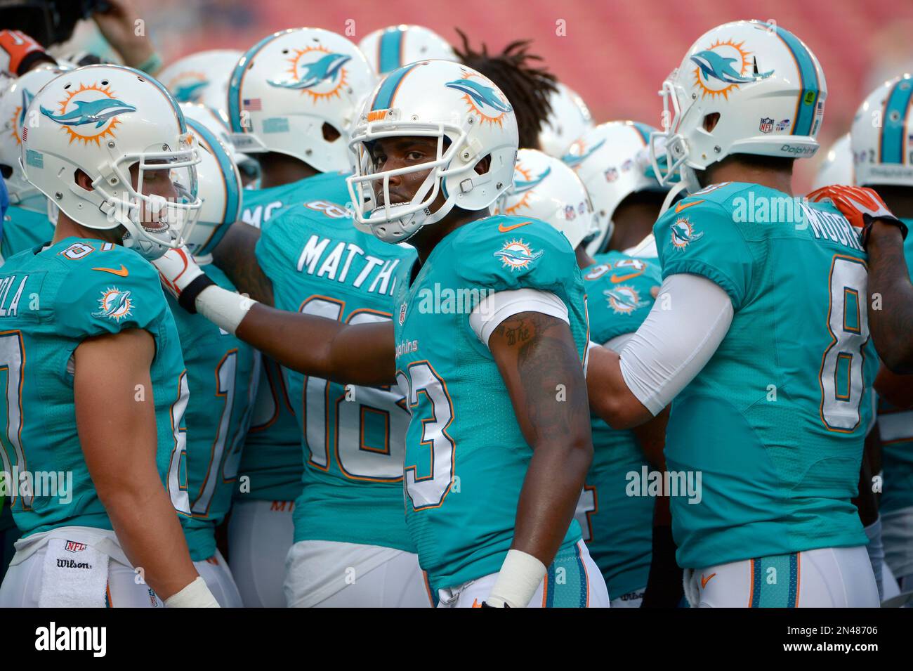 Miami Dolphins wide receiver Matt Hazel (83), center, huddles with the ...