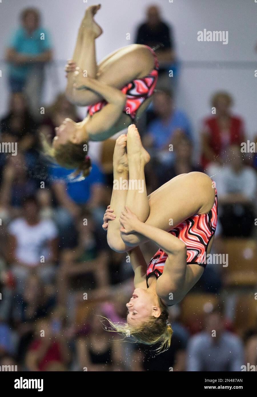 Russia's Yulia Timoshinina, bottom, and Ekaterina Petukhova compete ...