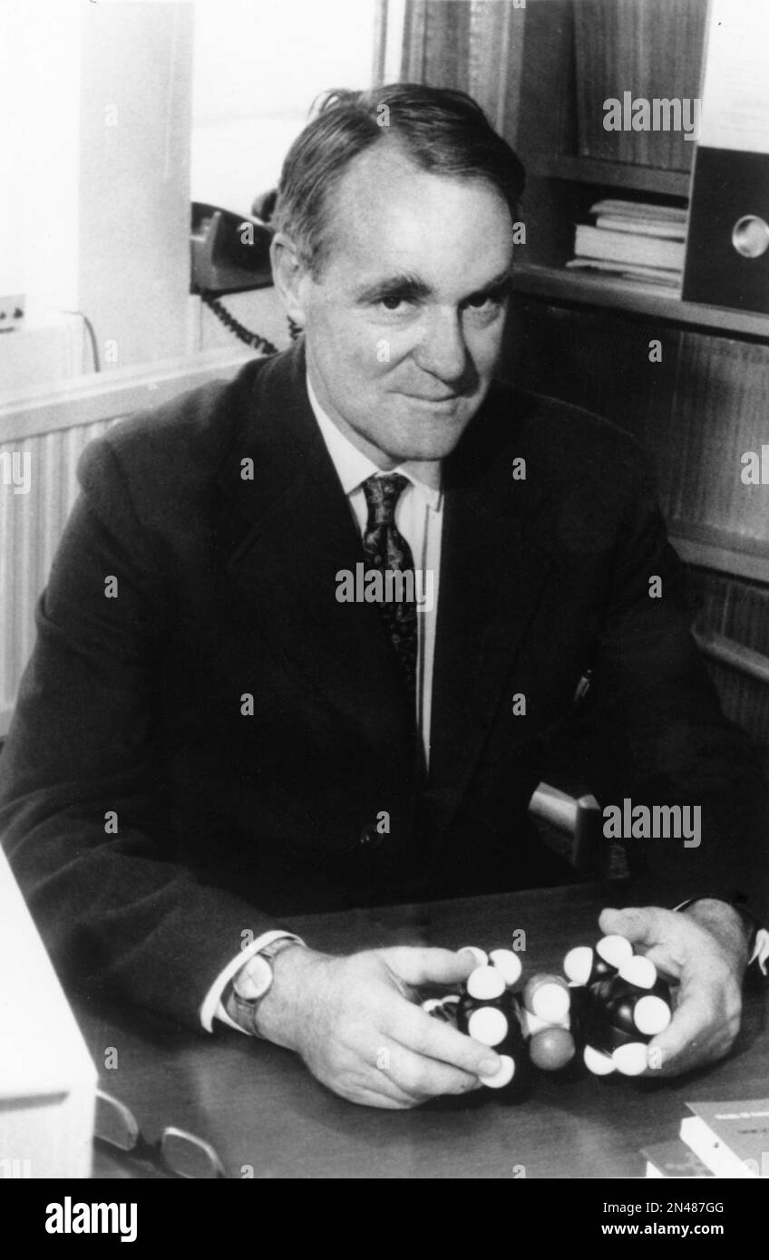 With a model of a molecule in his hand, Australian-born Professor John ...