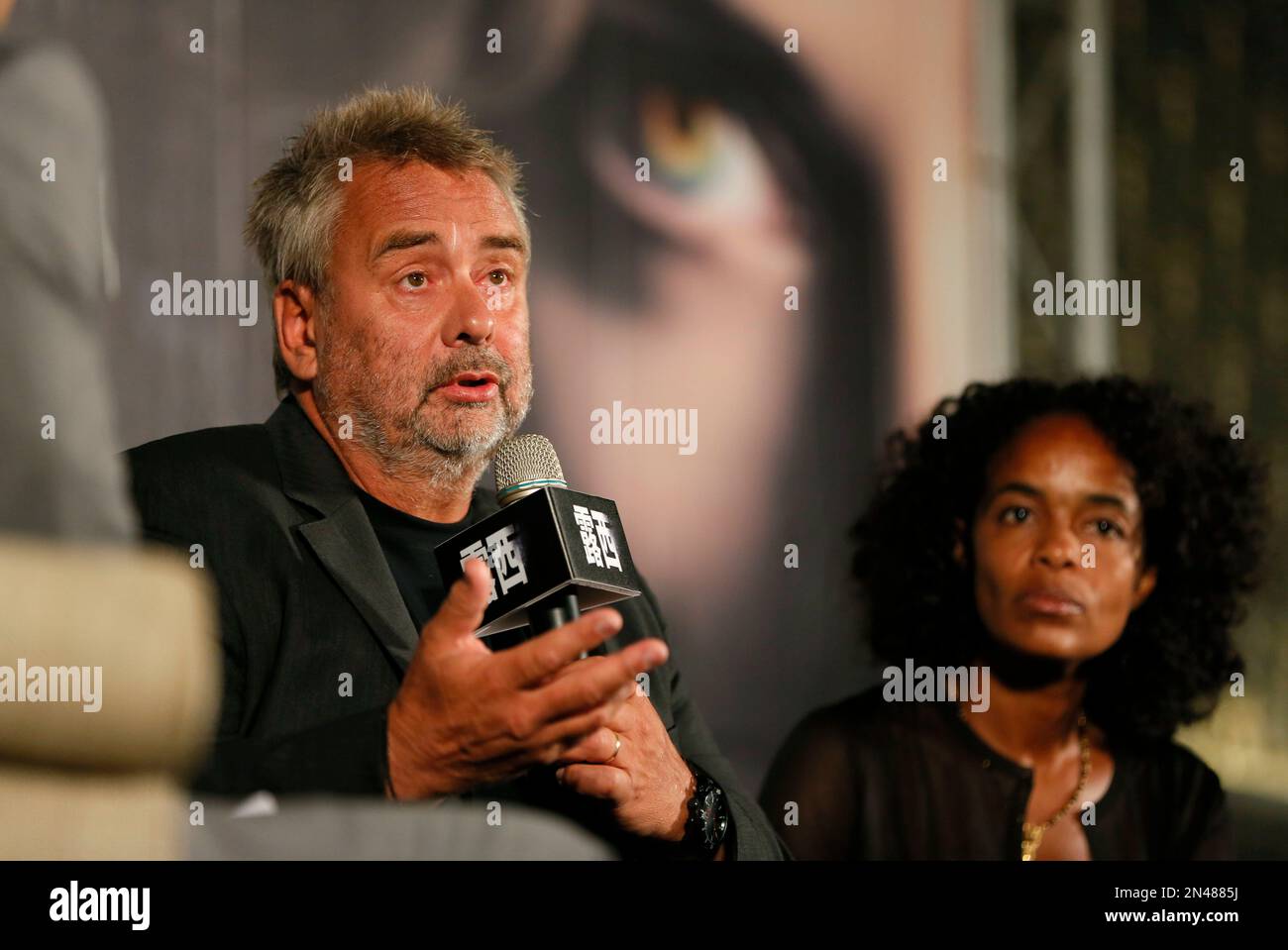 Flanked by wife and producer Virginie Silla, right, director Luc Besson ...