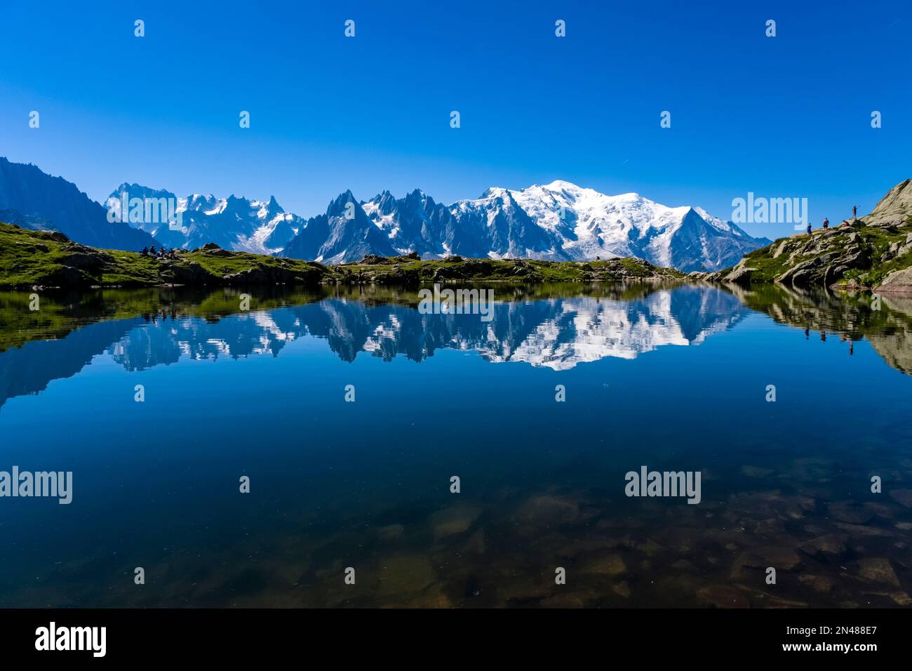 The peaks of the Mont Blanc massif are reflecting on the surface of Lacs des Chéserys Stock ...