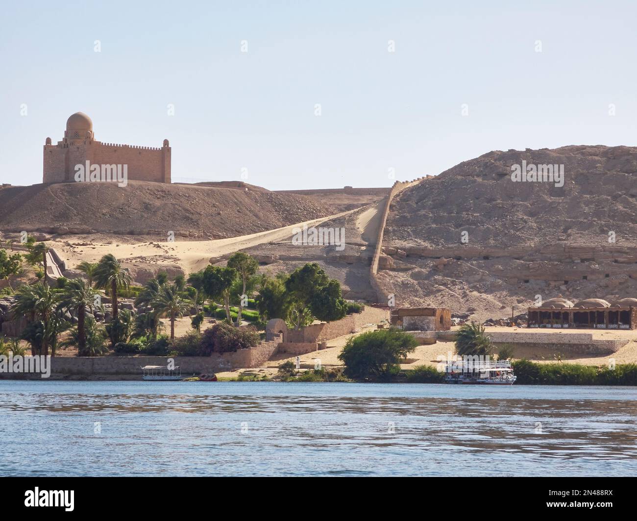 A beautiful nature scene with a Nile river in the desert surrounded by ...