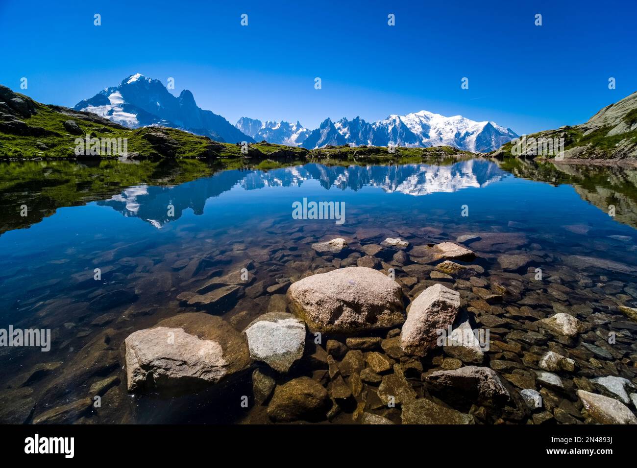 The peaks of the Mont Blanc massif are reflecting on the surface of Lacs des Chéserys Stock ...