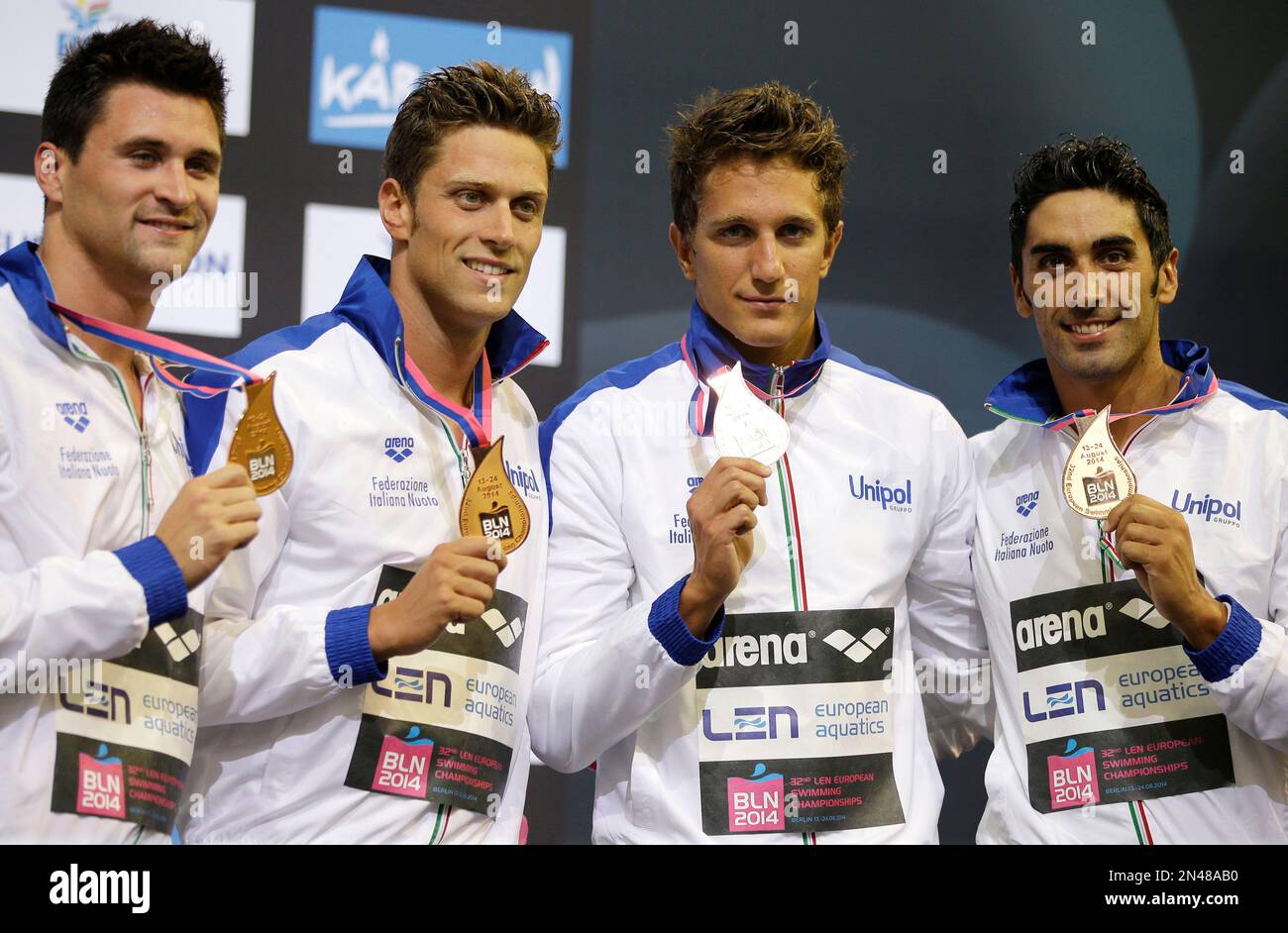 The Italian relay team show their bronze medals during the ceremony for ...