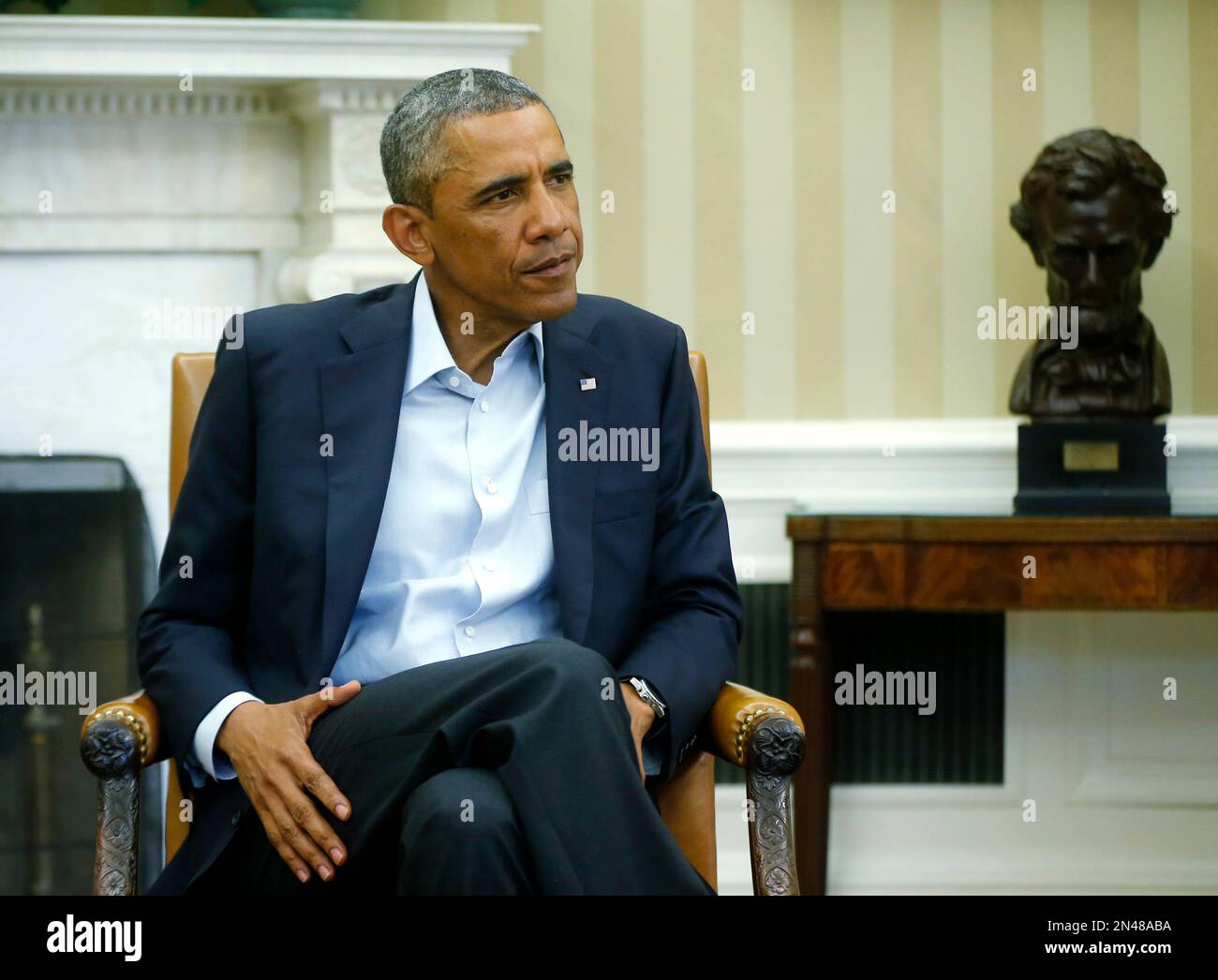 President Barack Obama listens as he meets with Attorney General Eric ...