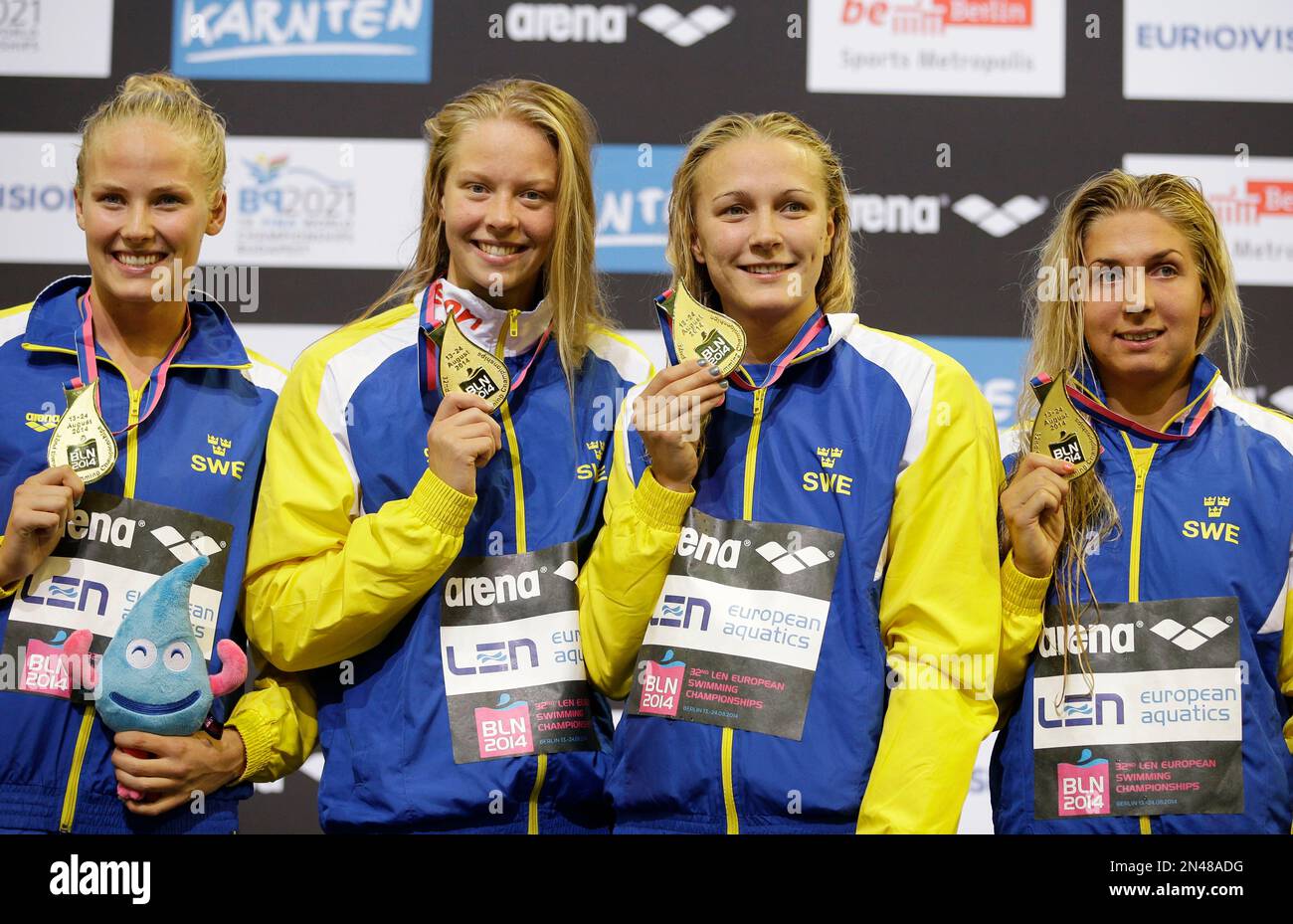 The Swedish relay team show their gold medals during the ceremony for ...