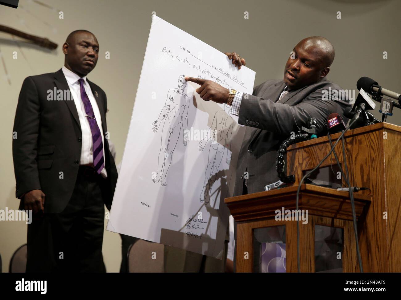 Attorneys Daryl Parks, right, and Benjamin Crump share preliminary ...