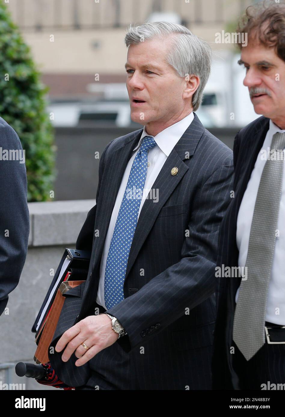 Former Virginia Gov. Bob McDonnell arrives at federal court with attorney Henry Asbill, right ...
