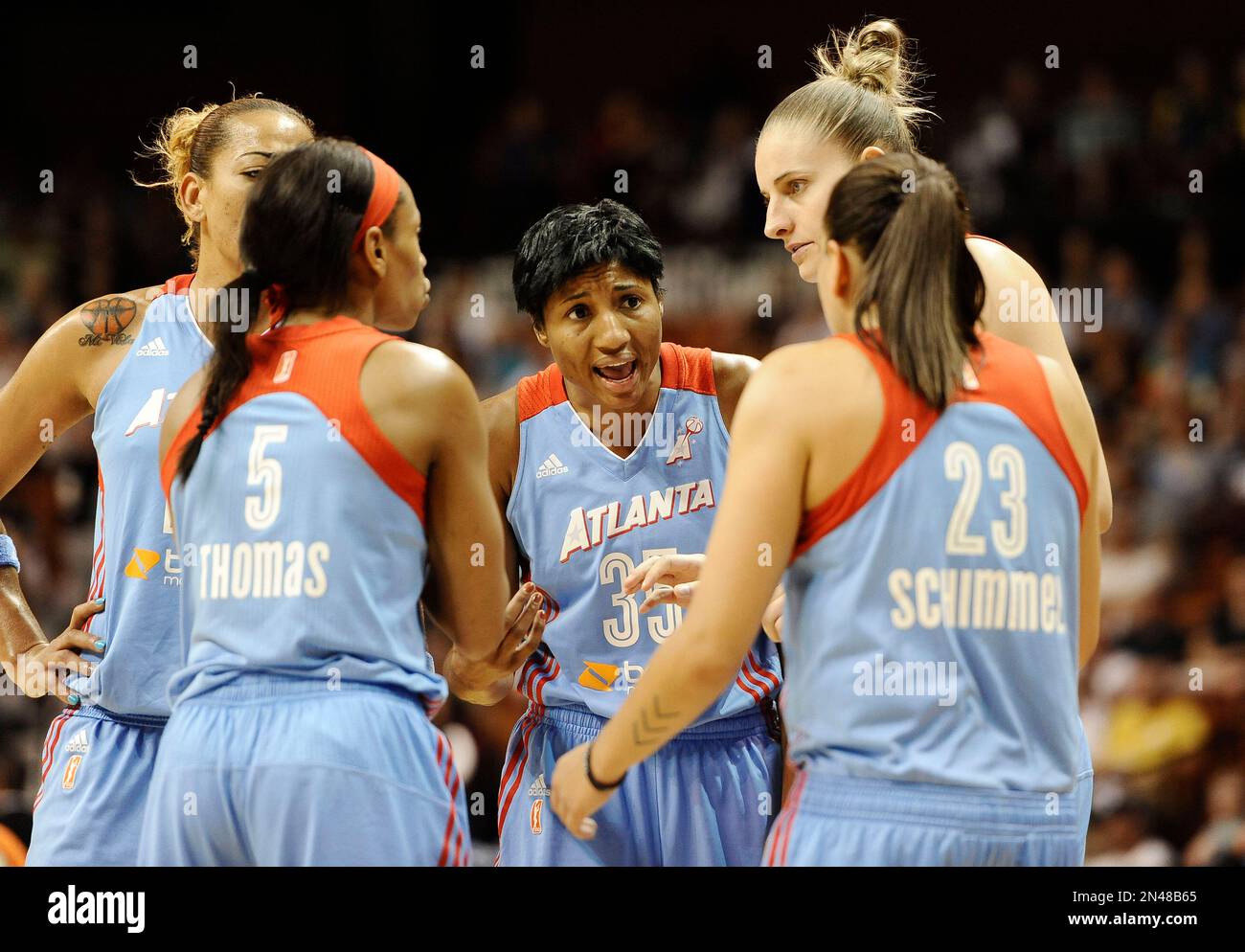 Atlanta Dream’s Angel McCoughtry, center huddles with her team during ...