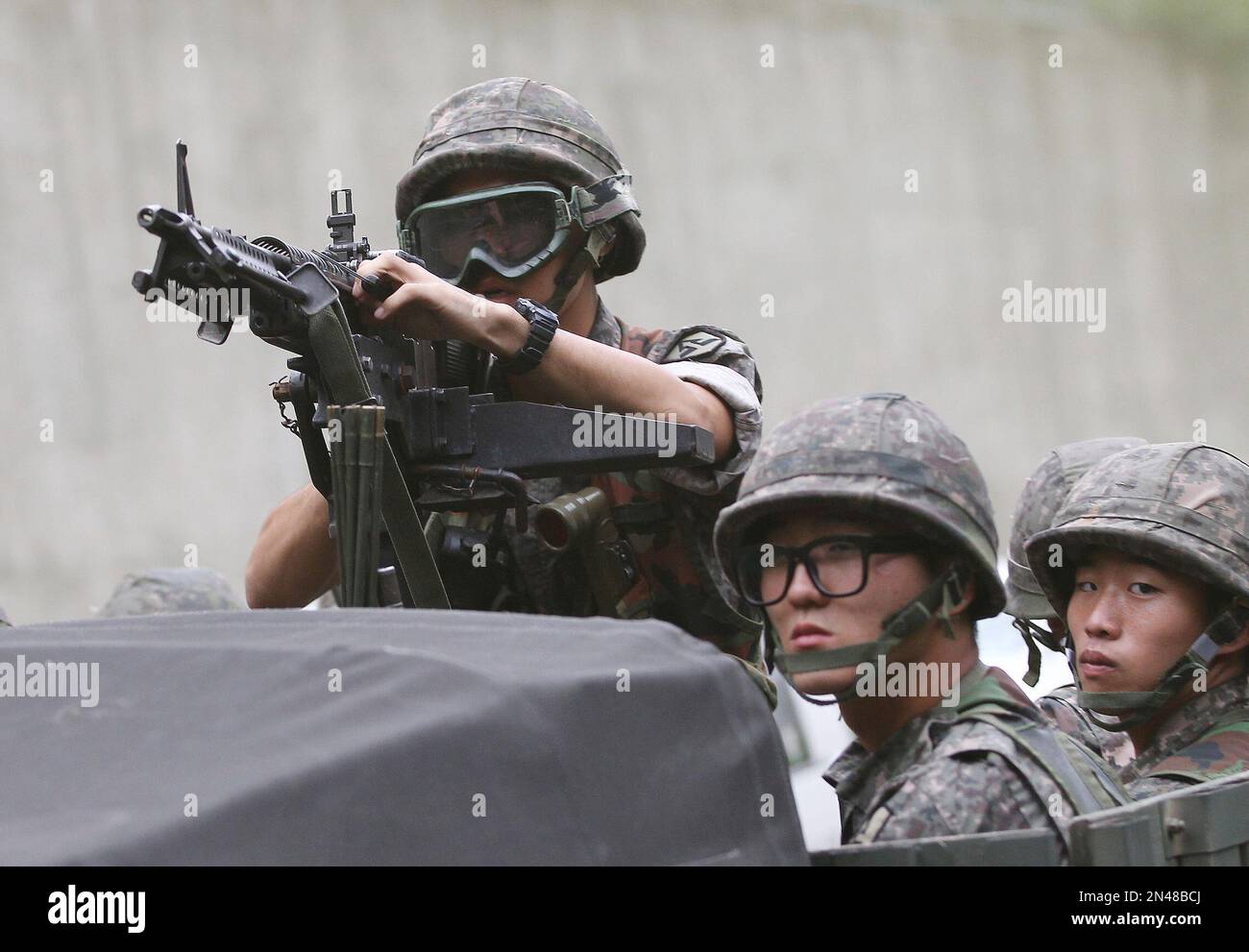 A South Korean aims his machine gun during an anti-terror exercise as ...