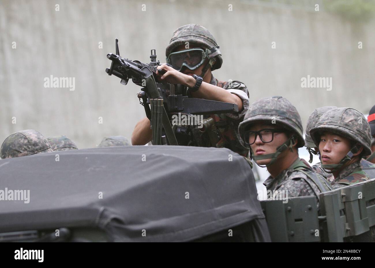 A South Korean soldier aims his machine gun during an anti-terror ...