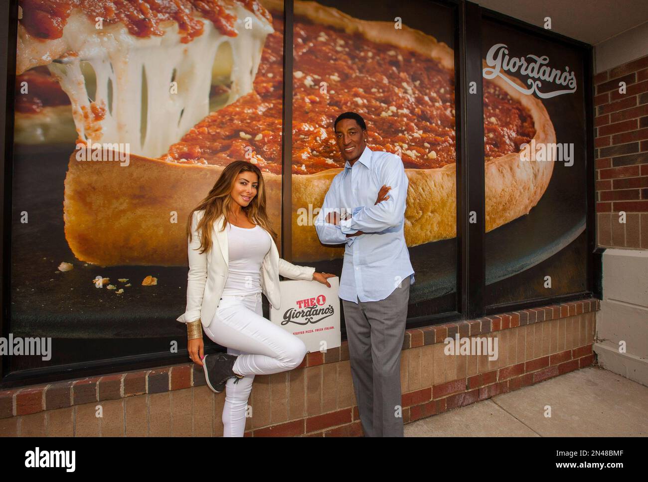 Basketball legend Scottie Pippen stands with his wife Larsa Pippen ...