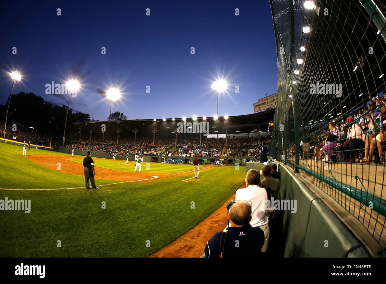 The sunsets on Lamade Stadium during a baseball game between ...
