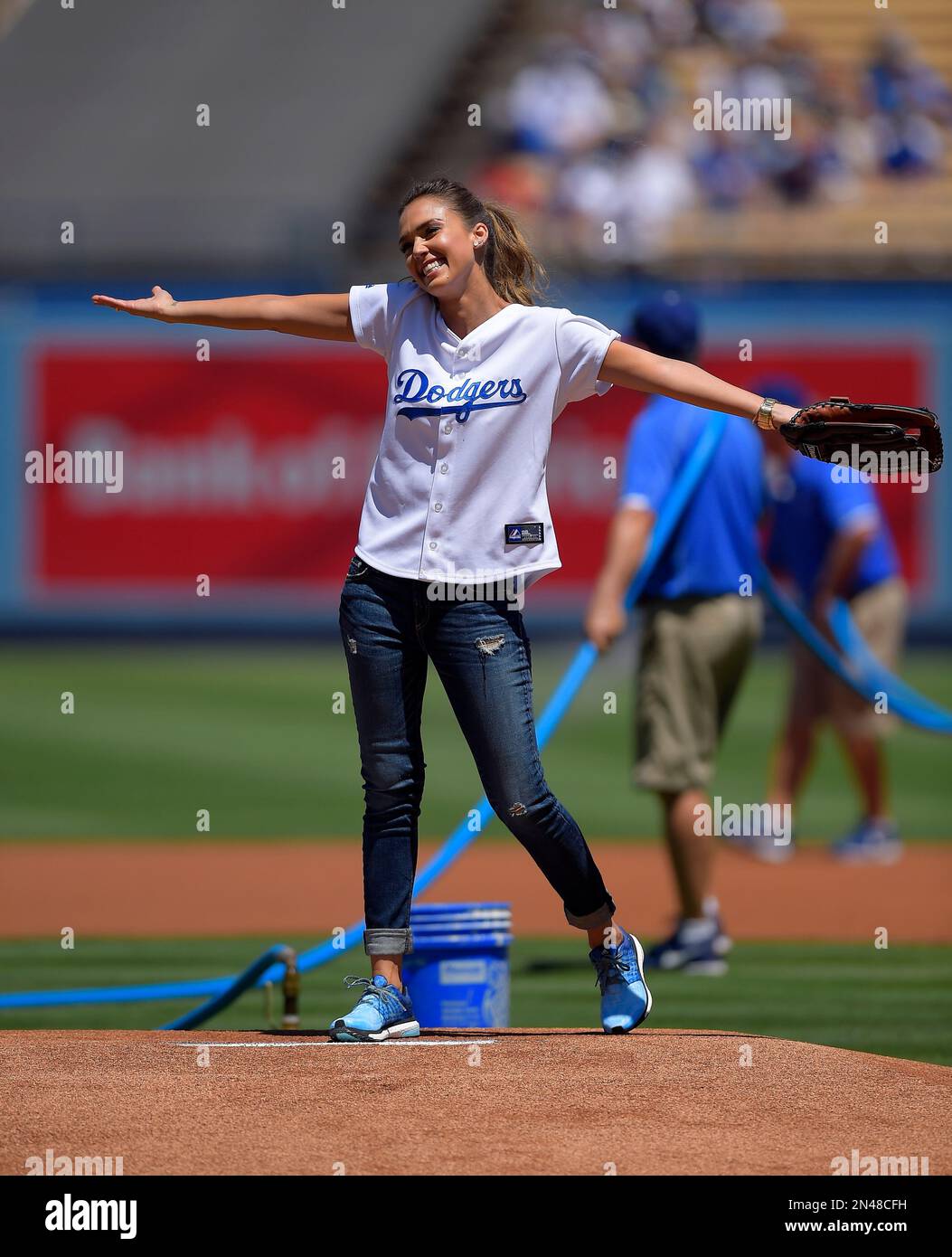 Actress Jessica Alba gestures after throwing out the ceremonial first ...