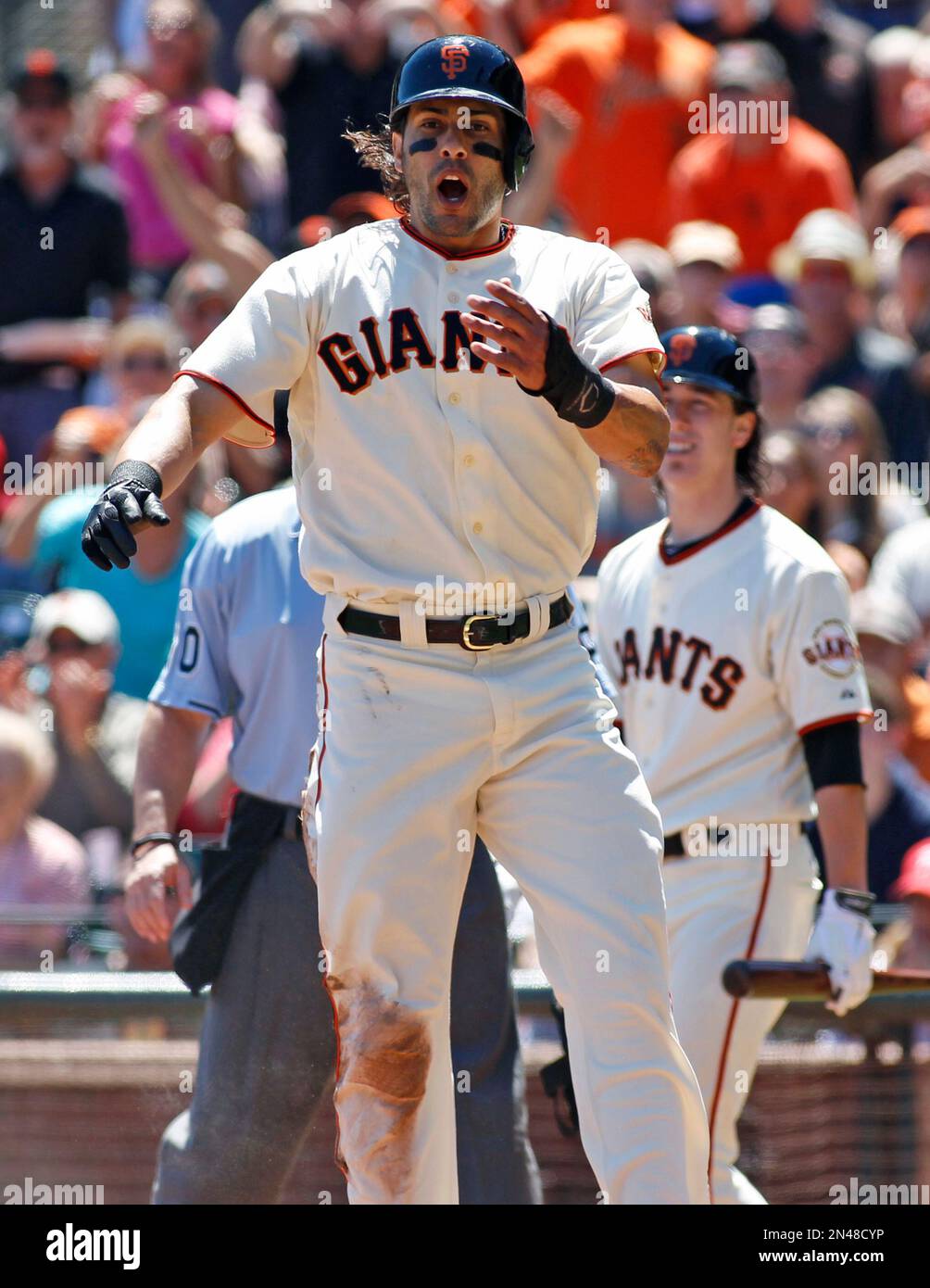 San Francisco Giants' Michael Morse reacts after scoring against the Philadelphia Phillies ...