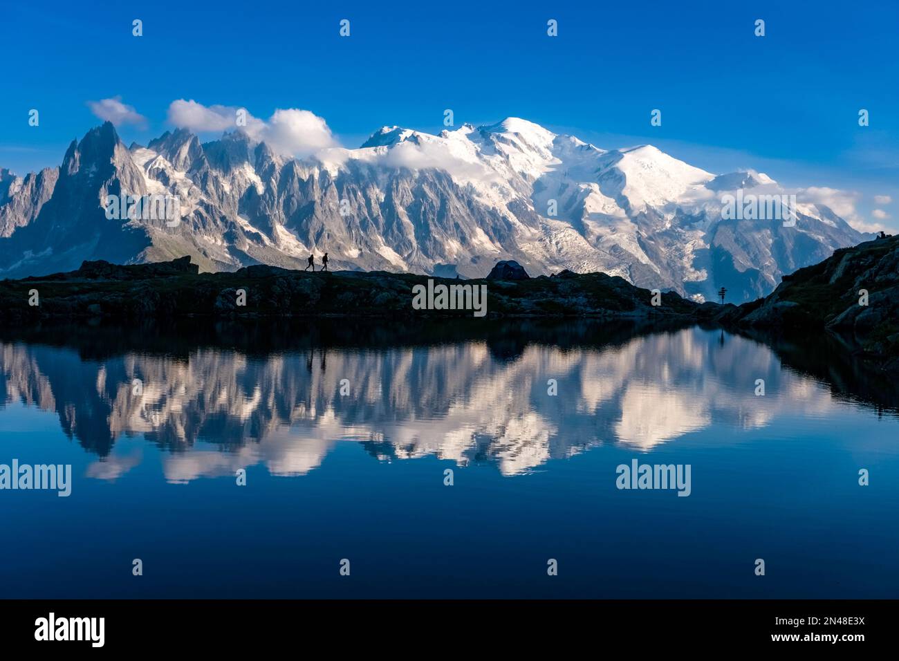 The peaks of the Mont Blanc massif are reflecting on the surface of Lacs des Chéserys, two ...
