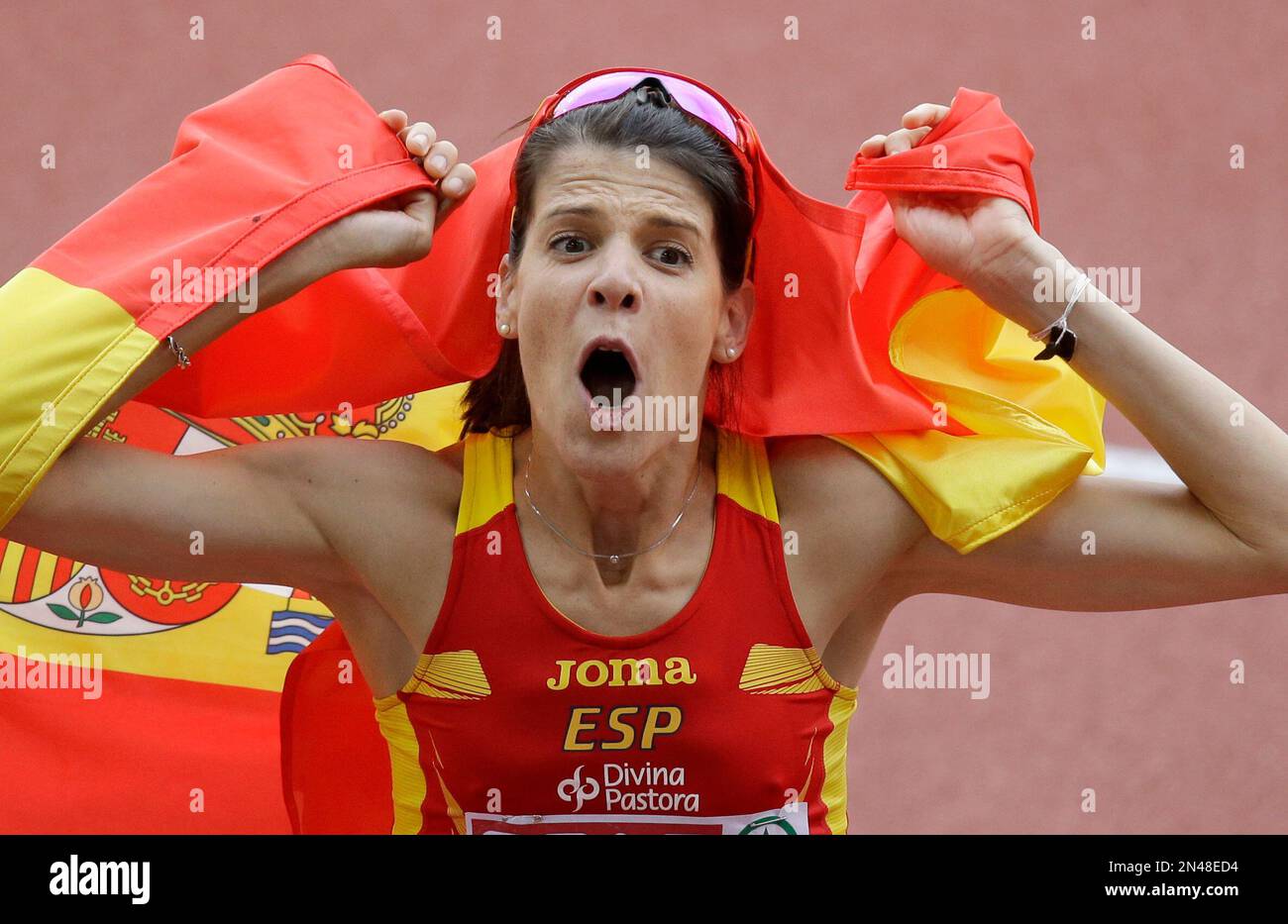 Spain's Ruth Beitia celebrates with the Spanish flag after winning the ...