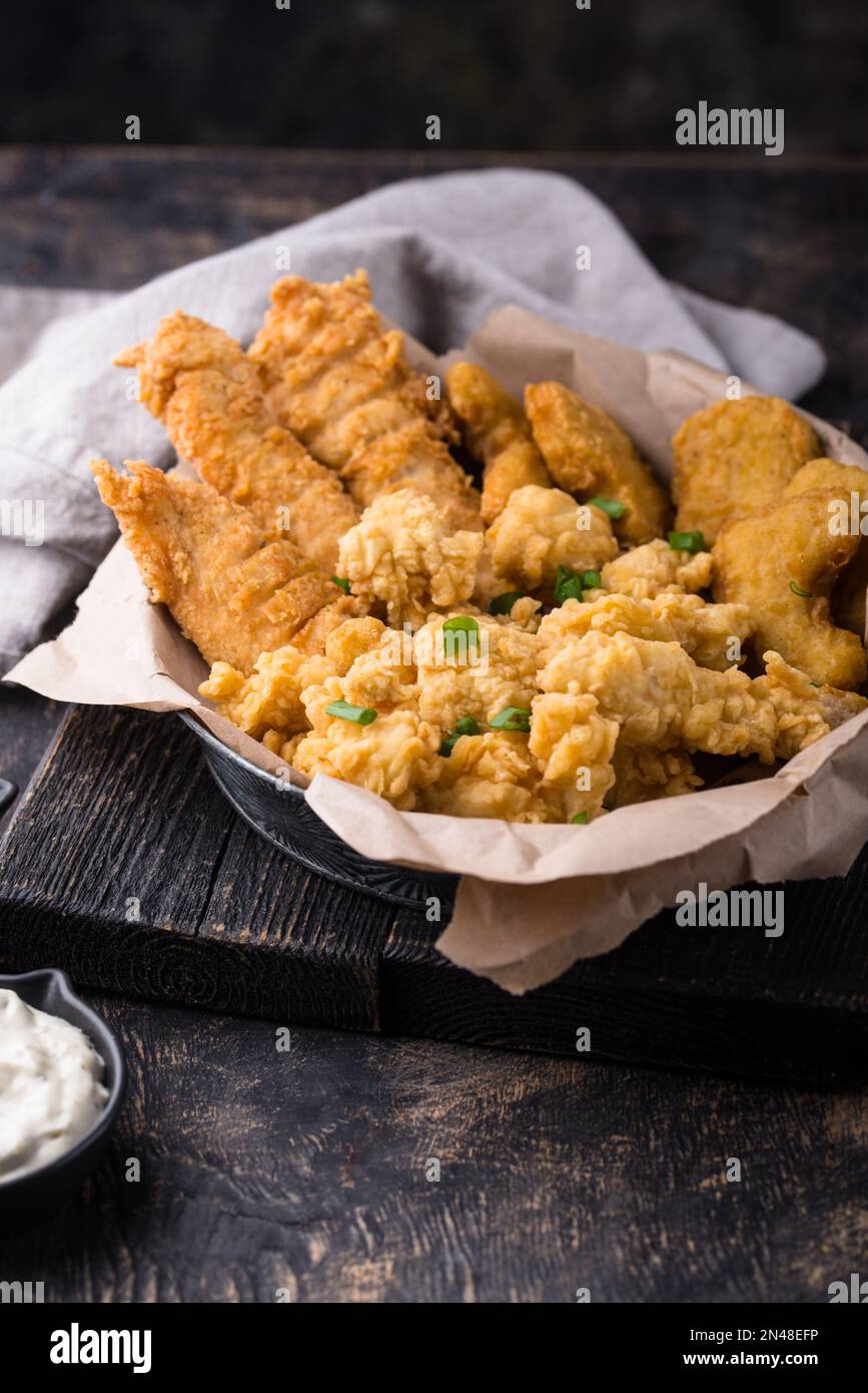 Chicken nuggets, strips and bites Stock Photo - Alamy