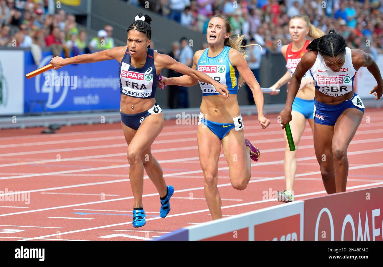 France's Floria Guei, left, crosses the line to win gold in the women's ...