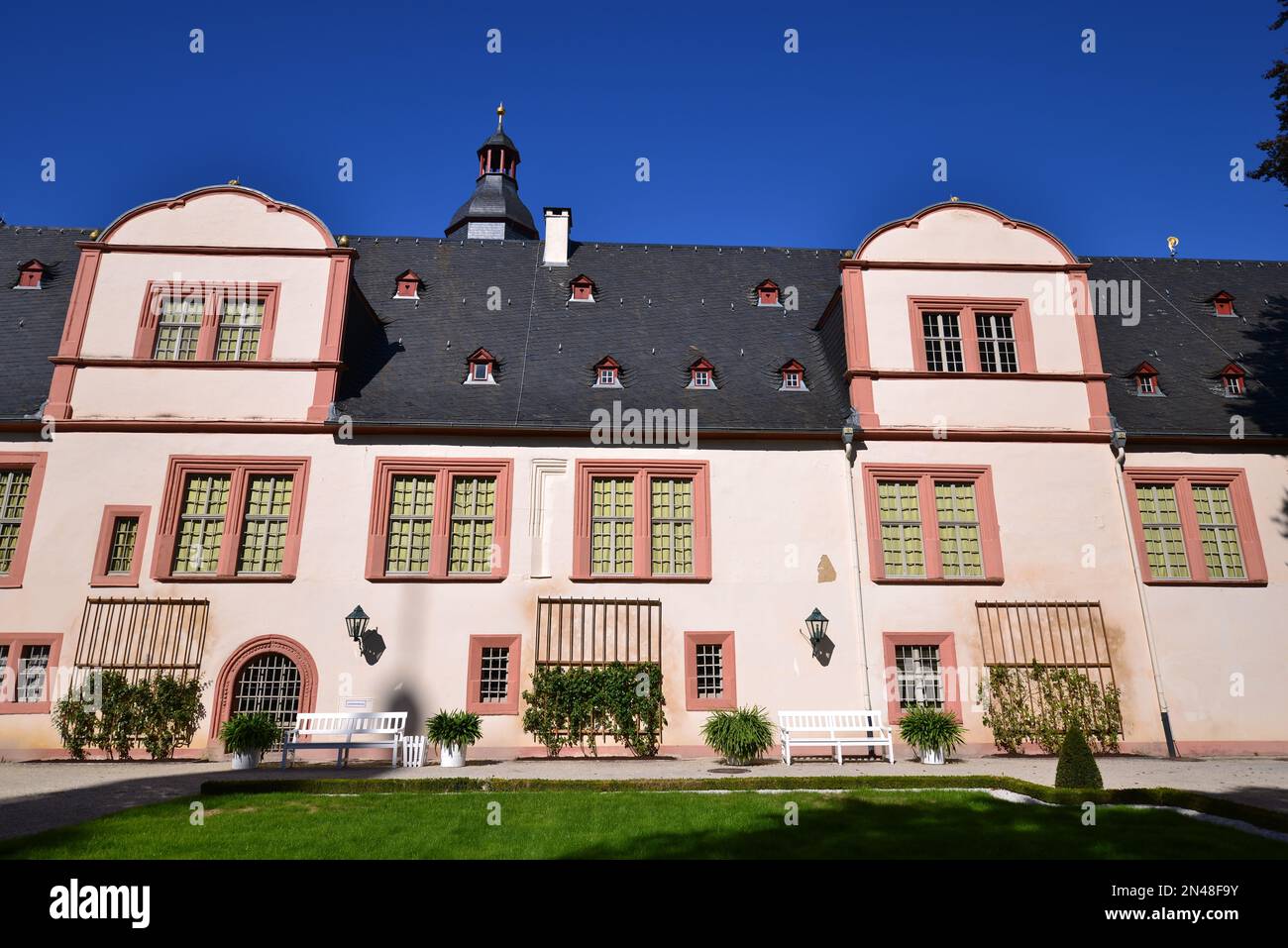 A scenic view of a backyard and the castle of Weilburg architecture ...