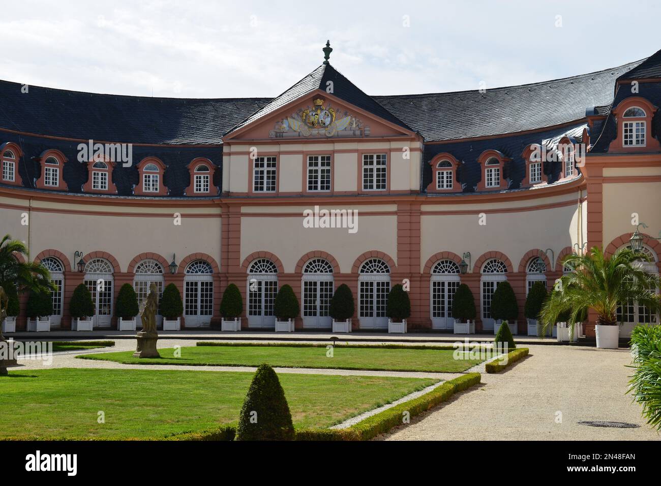 A scenic view of a backyard and the castle of Weilburg architecture ...