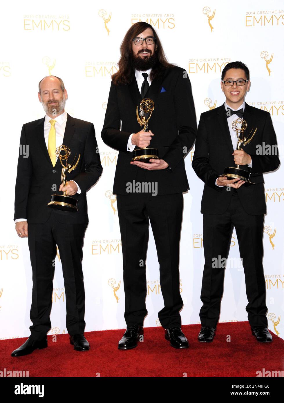 From left, Paul Rudish, Derek Dressler, and Alonso Ramirez Ramos pose ...
