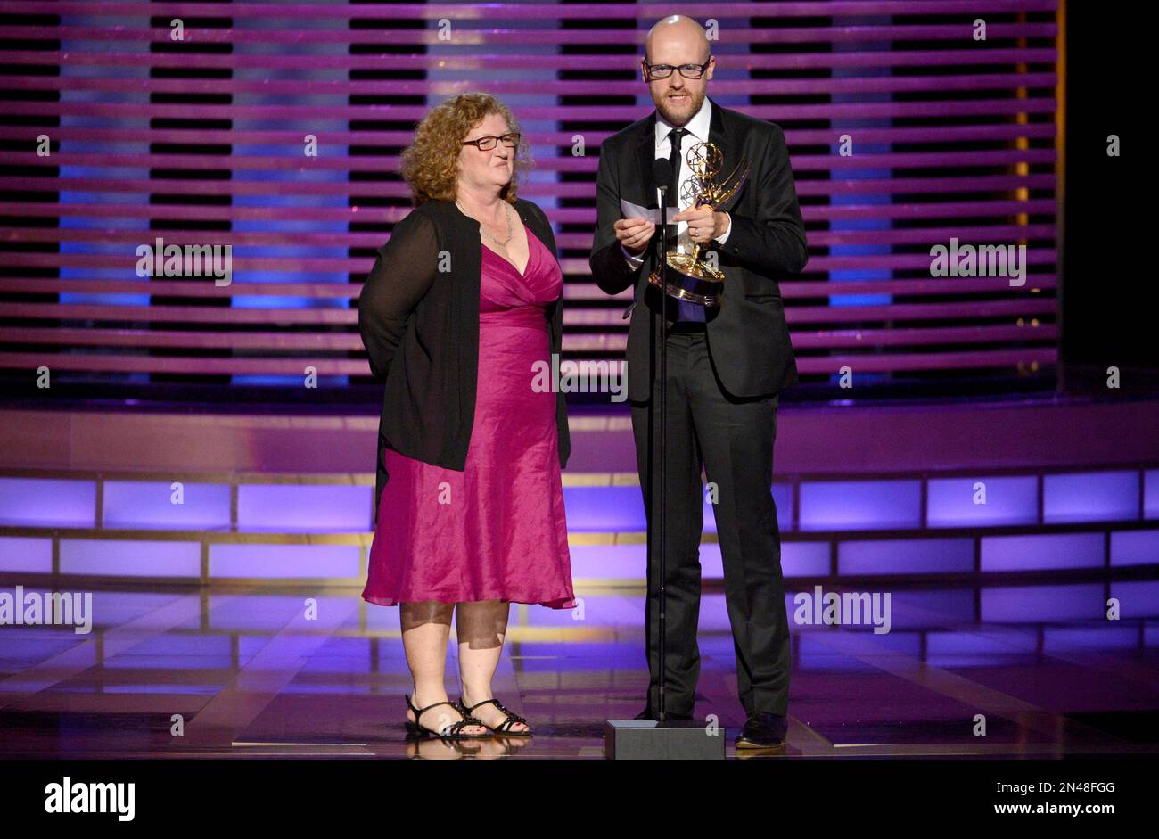 Jane Walker, left, and Barrie Gower accept the award for outstanding ...