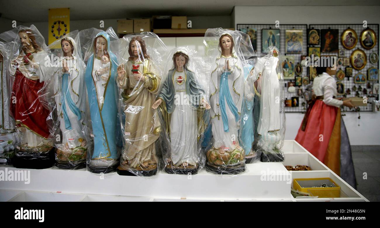 Religious items are sold in a shop during Pope Francis' visit at the ...