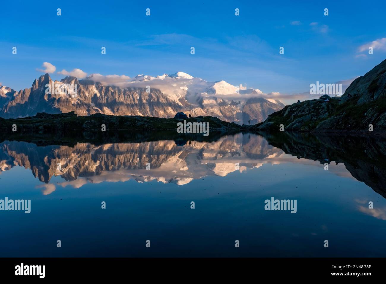 The peaks of the Mont Blanc massif are reflecting on the surface of Lacs des Chéserys Stock ...