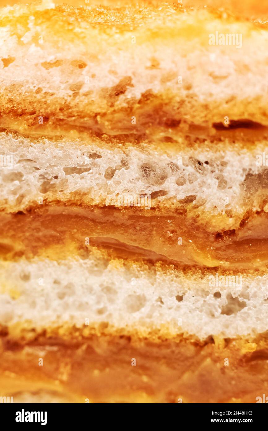Layers of waffles with condensed milk closeup Stock Photo - Alamy