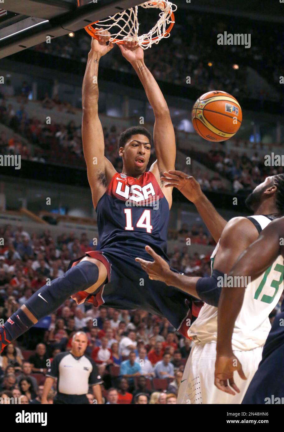United States' Anthony Davis (14), of the New Orleans Pelicans, dunks ...