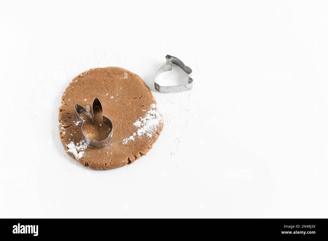 Raw easter gingerbread dough with cutters and flour. Preparation of ...