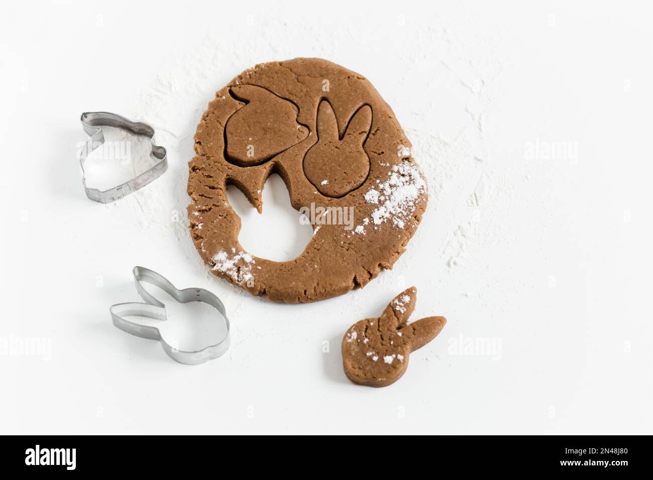 Raw easter gingerbread dough with cutters and flour. Preparation of ...