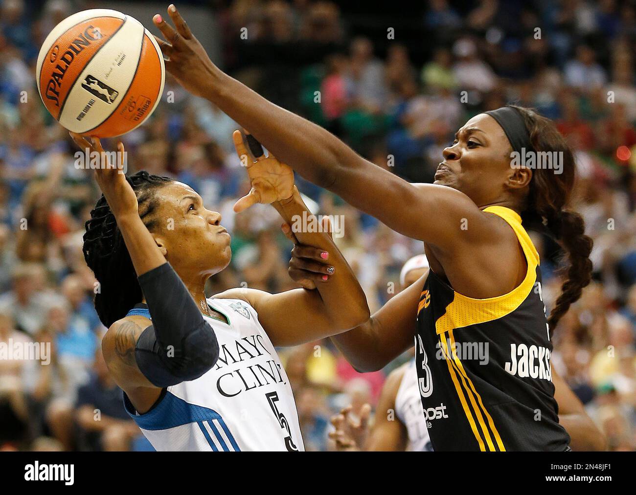 Minnesota Lynx guard Tan White (5) tries to pass the ball against Tulsa ...
