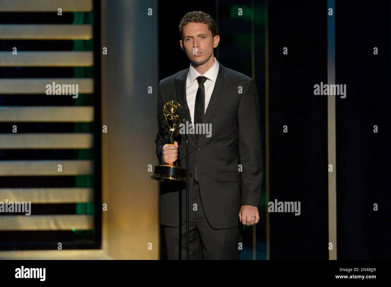 Ian Worrel accepts the award for outstanding individual achievement in ...