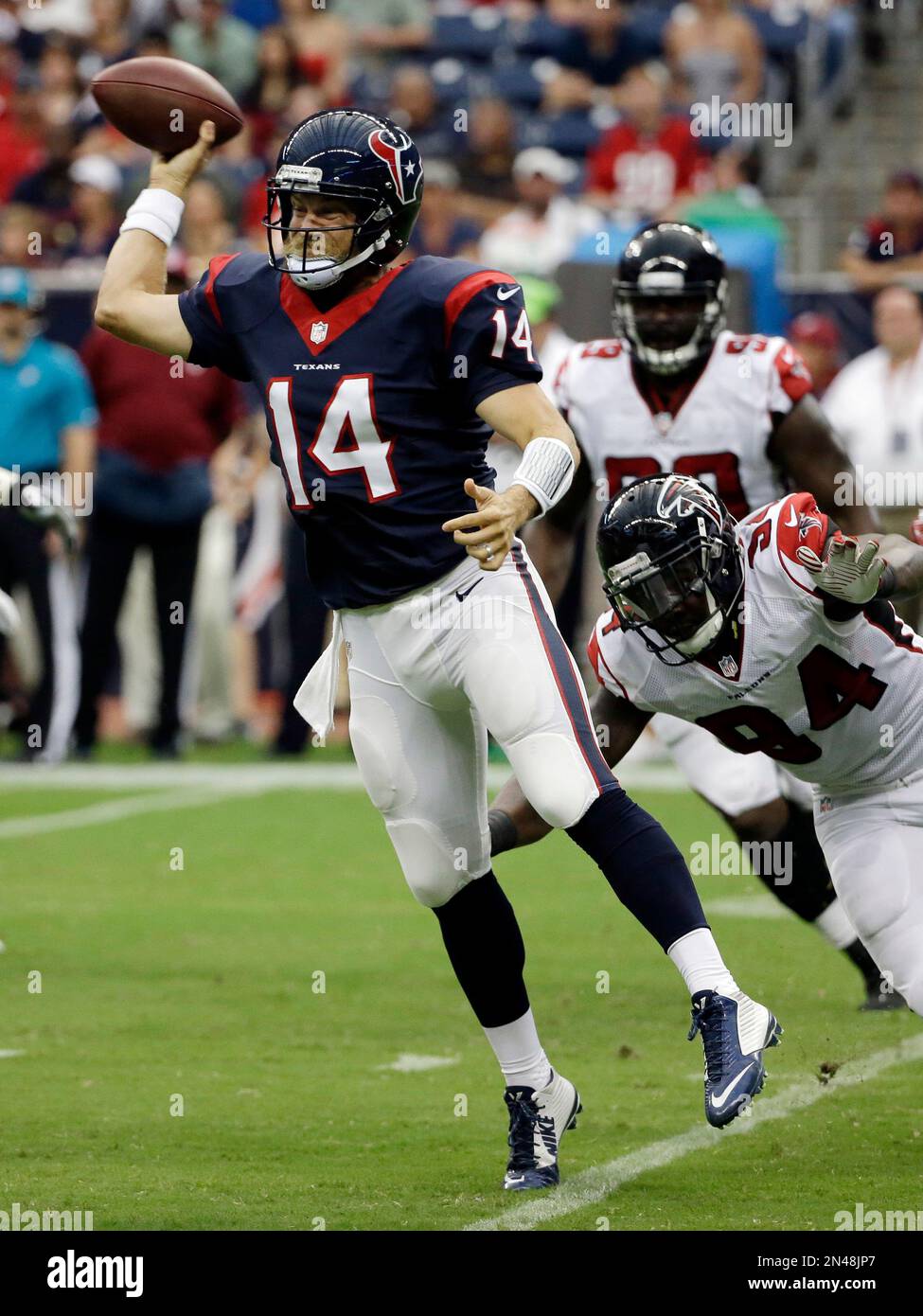 Houston Texans' Ryan Fitzpatrick (14) throws under pressure from ...