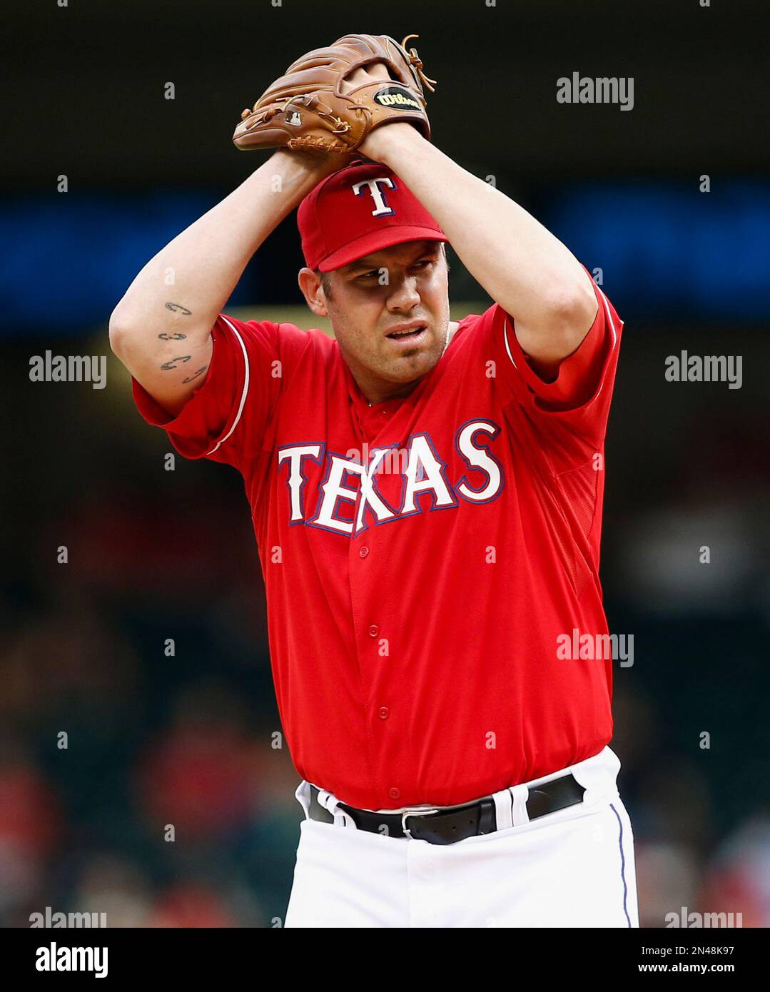 Texas Rangers starting pitcher Colby Lewis throws to the Los Angeles ...