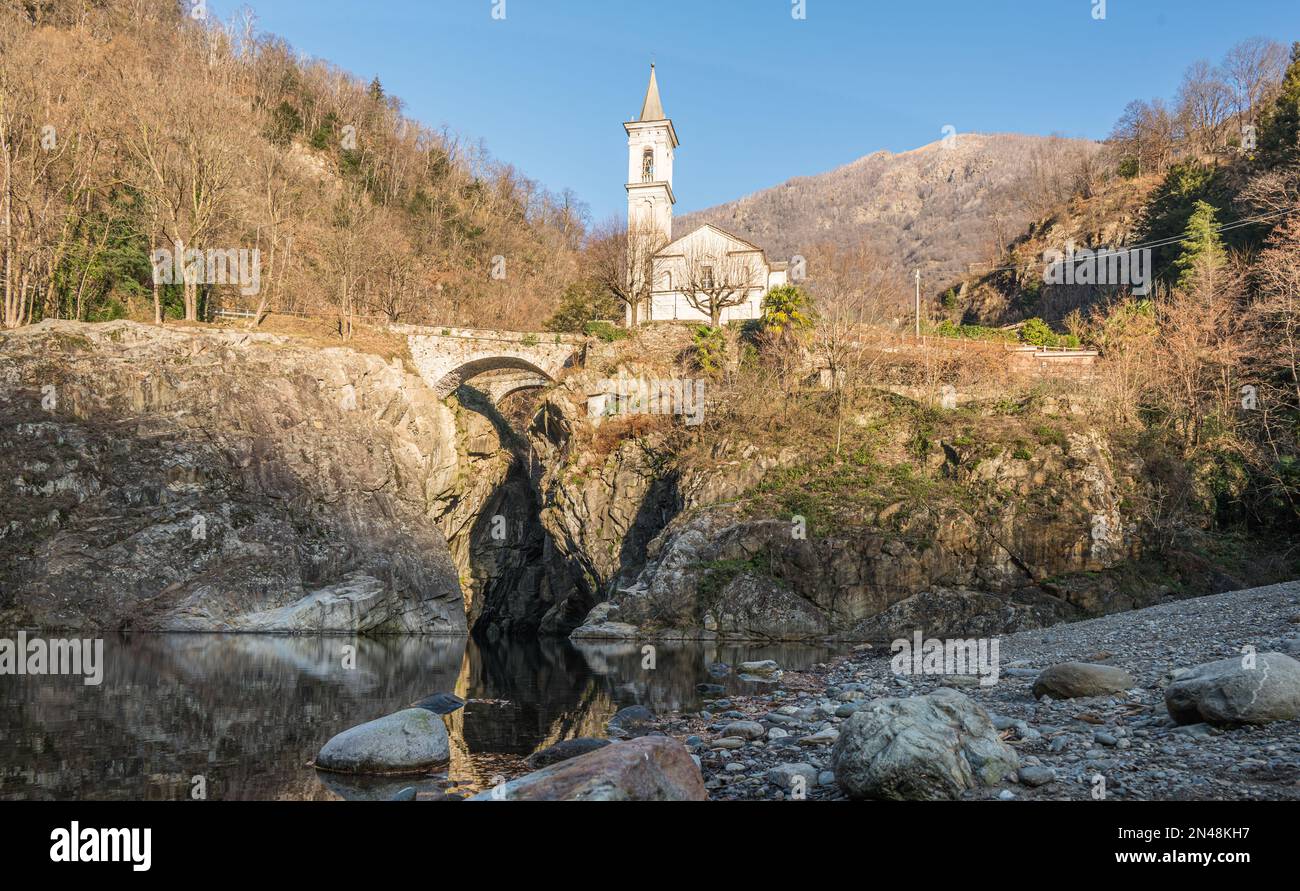 The beautiful ravine of Sant'Anna with the church reflected in the ...